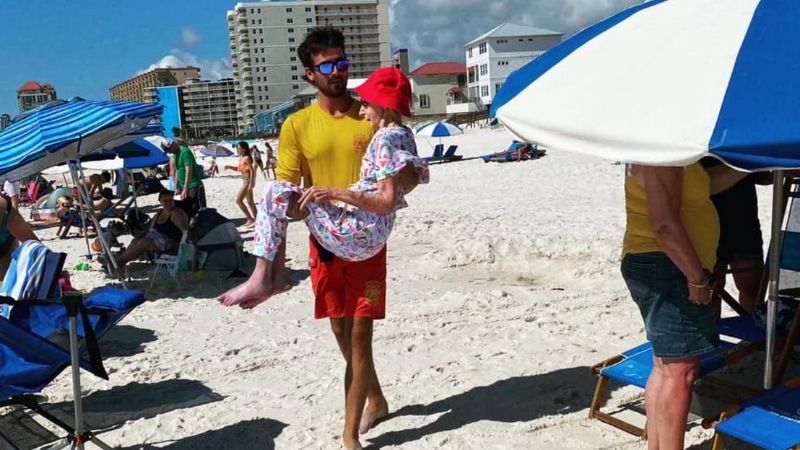 ‘These Guys Earned Their Wings’: Lifeguards Carry 95-Year-Old to Beach ...